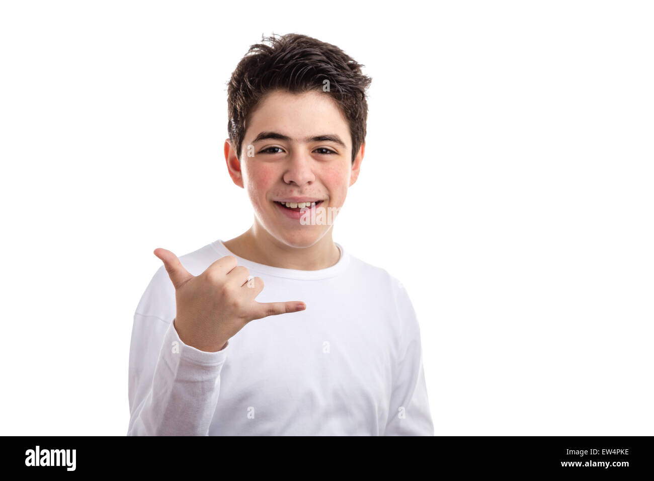 Caucasian boy wearing a white long sleeve t-shirt smiles doing Hawaiian ...