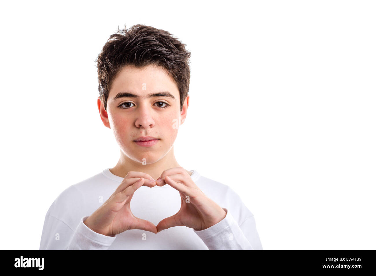 Caucasian young boy with acne-prone skin. in a white long sleeved t ...
