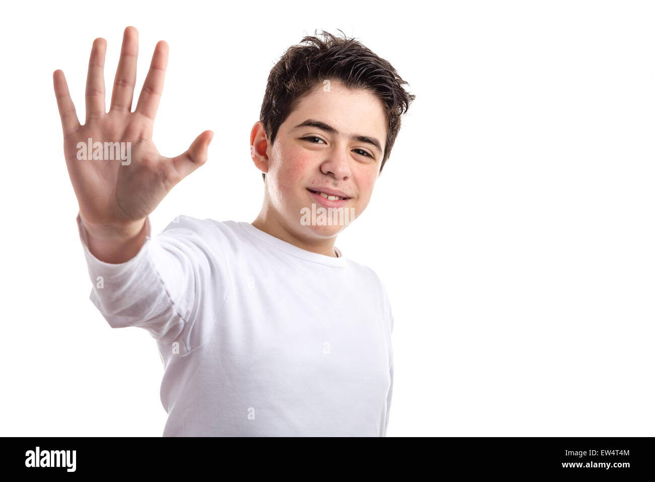 Hispanic teen with acne skin in a white long sleeve t-shirt smiles ...