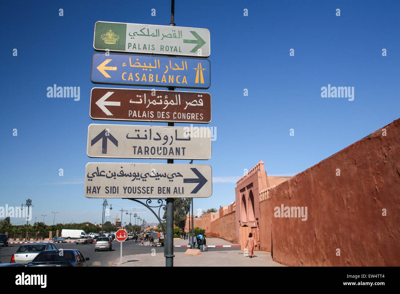 Signpost alongside large wall near the Royal Palace in Marrakesh ...