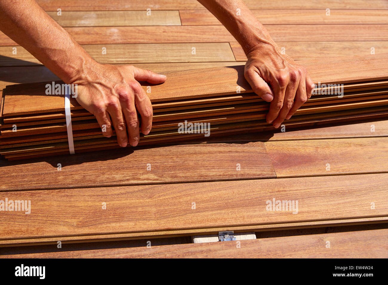 Ipe teak decking deck wood installation clips fasteners Stock Photo - Alamy