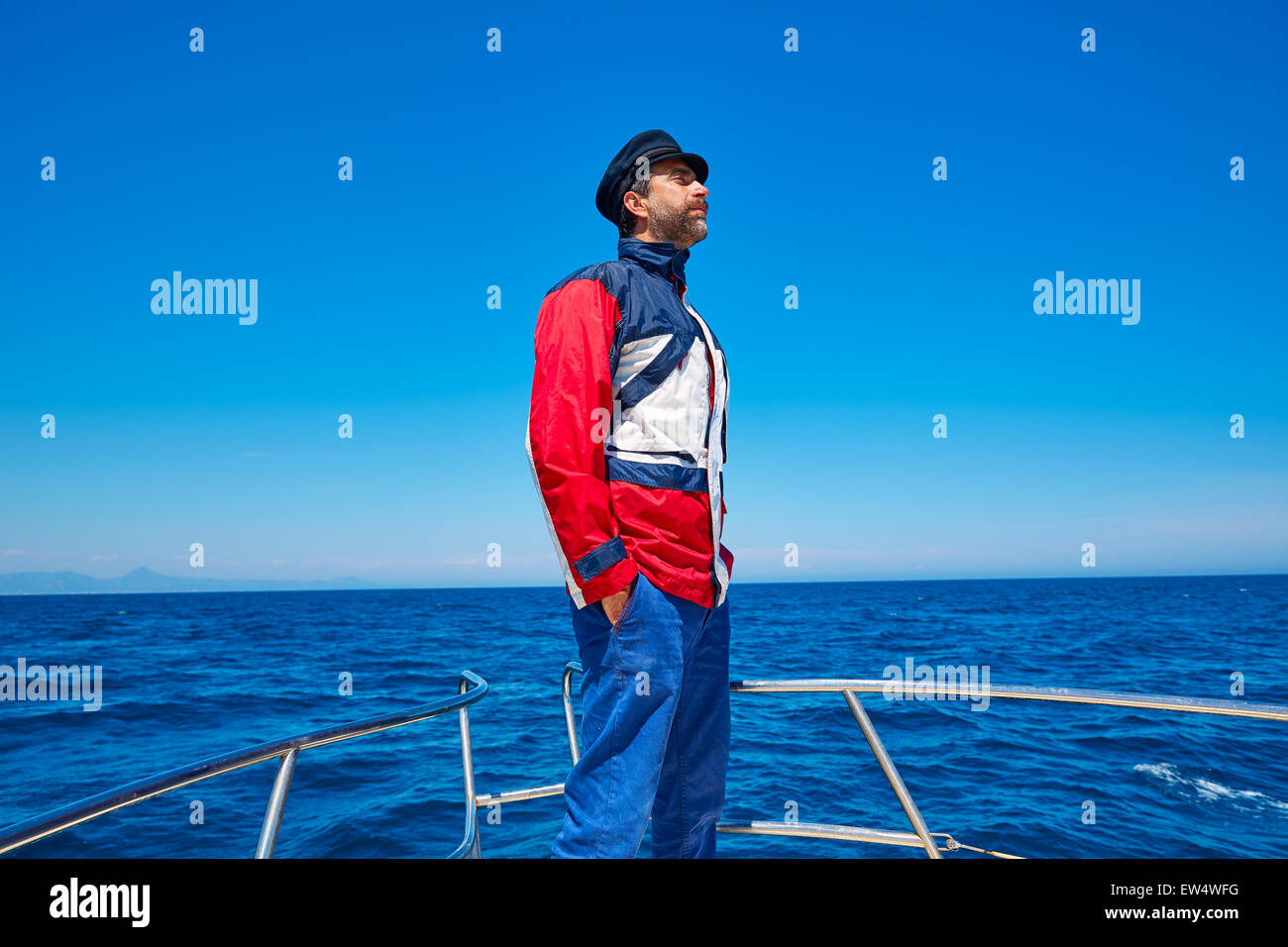 Beard sailor man sailing sea ocean in a boat with captain cap looking ...