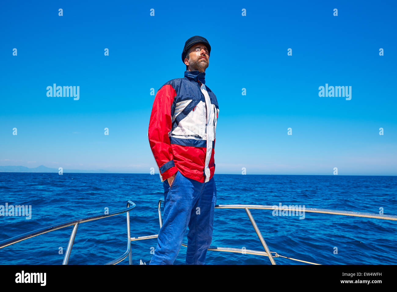 Beard sailor man sailing sea ocean in a boat with captain cap looking ...