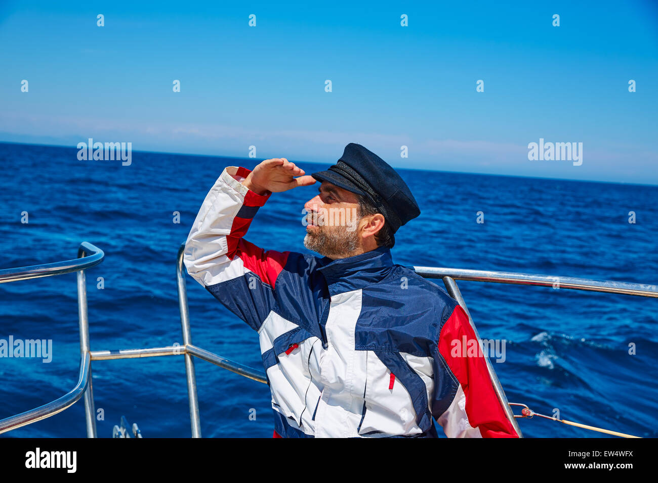 Beard sailor man sailing sea ocean in a boat with captain cap looking ...