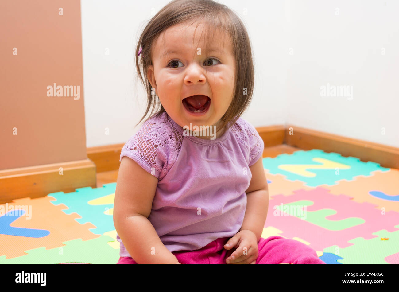 Adorable baby girl screaming Stock Photo - Alamy