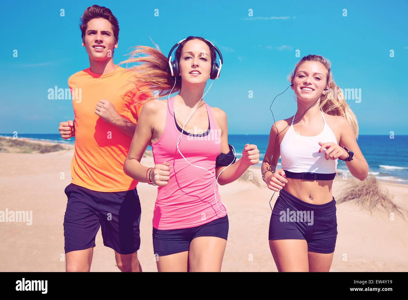friends running on the beach happy in summer sunny day Stock Photo - Alamy