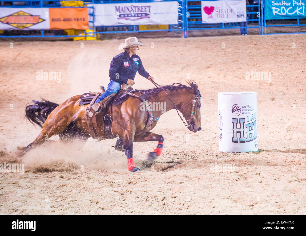 Cowgirl Participating in a Barrel racing competition at the Helldorado ...