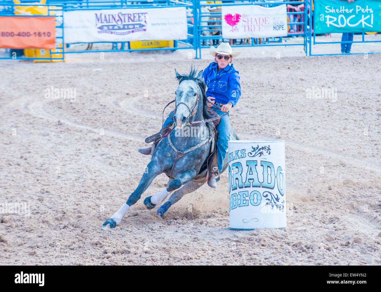 Cowgirl Participating in a Barrel racing competition at the Helldorado ...