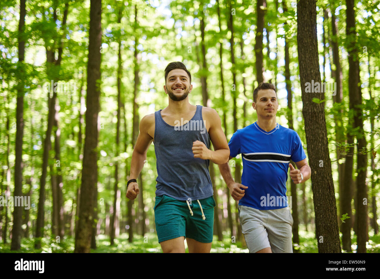 Two boys running forest hi-res stock photography and images - Alamy