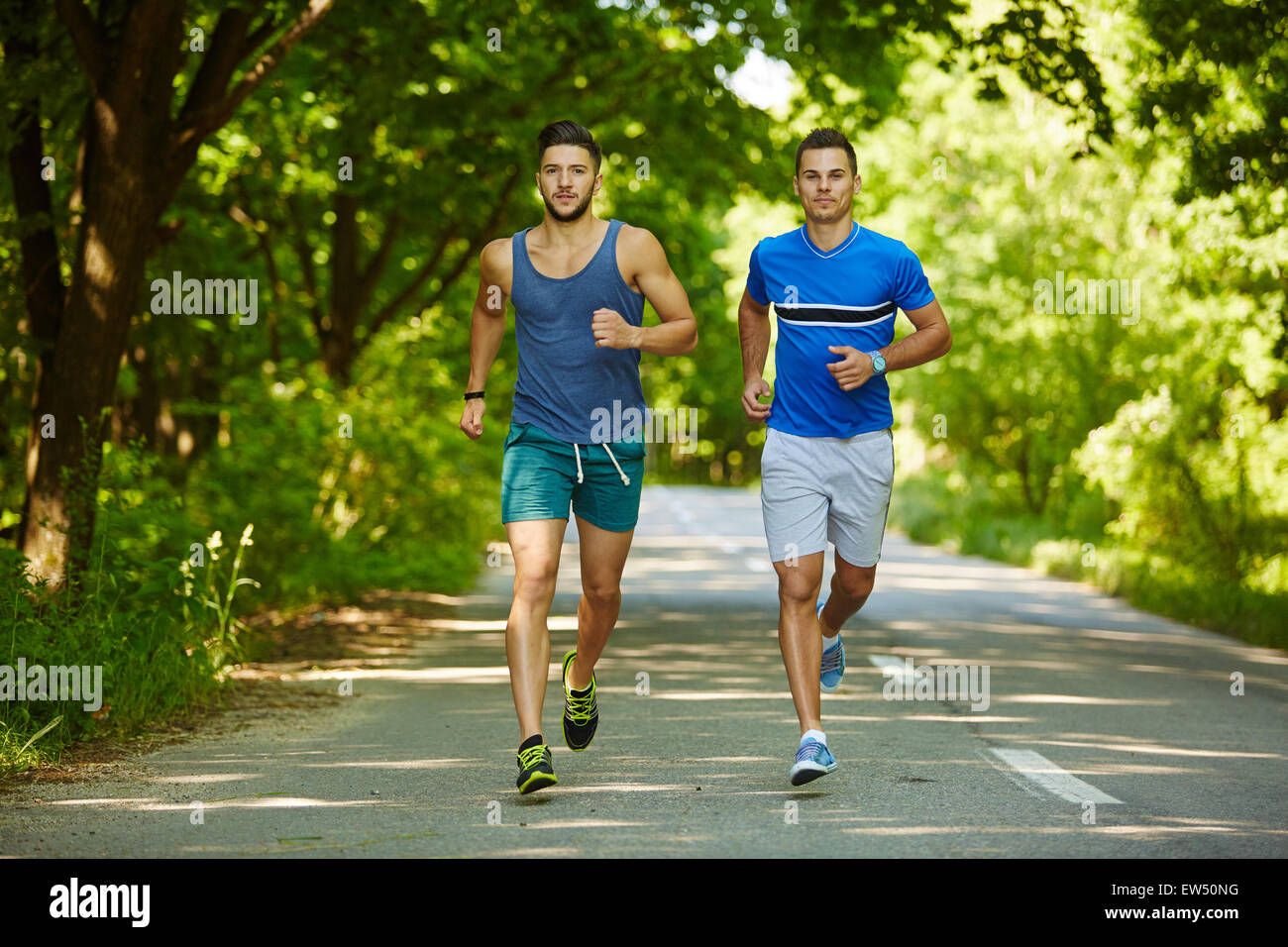 Two boys running forest hi-res stock photography and images - Alamy