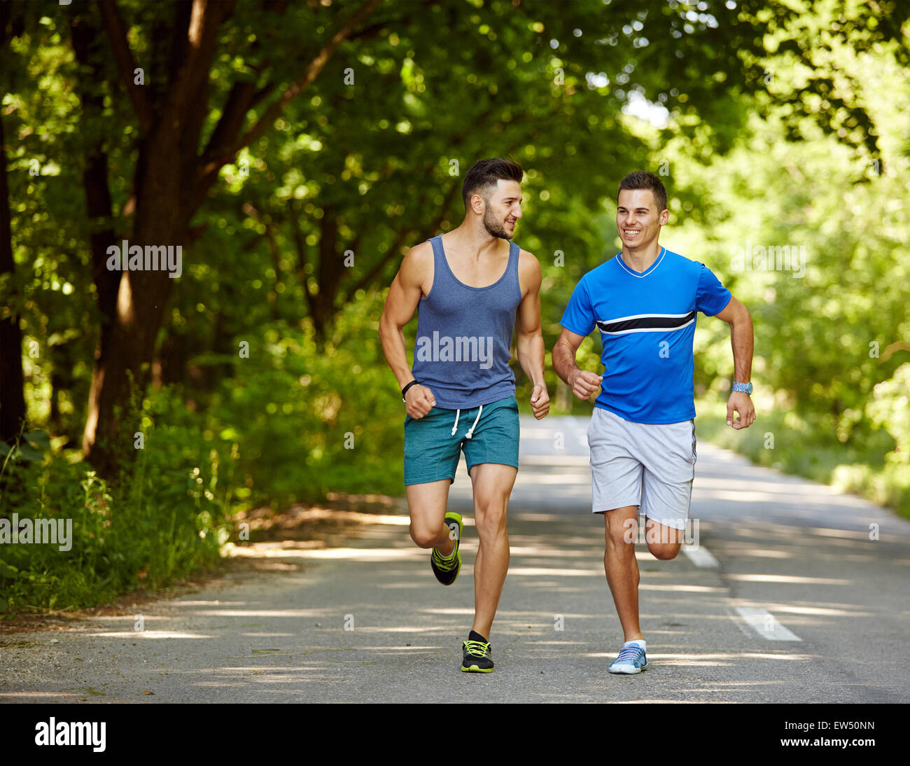Two boys running forest hi-res stock photography and images - Alamy