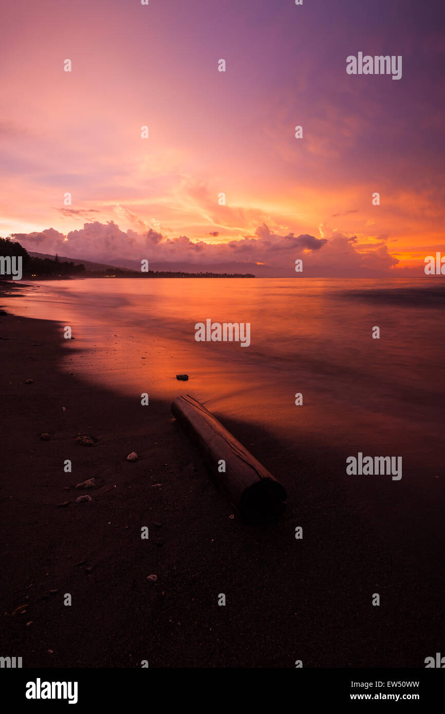 Vibrant tropical sunset at Bali indonesia Stock Photo - Alamy