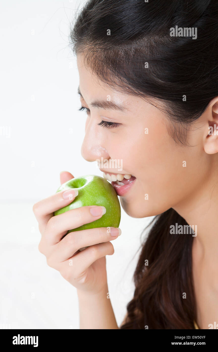 Mouth eating apple hi-res stock photography and images - Alamy