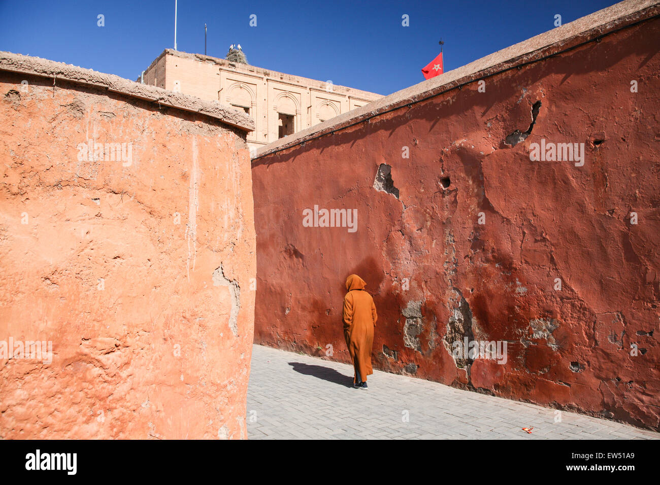 Local man wearing long-hooded cloak known as a djellaba, worn by both ...