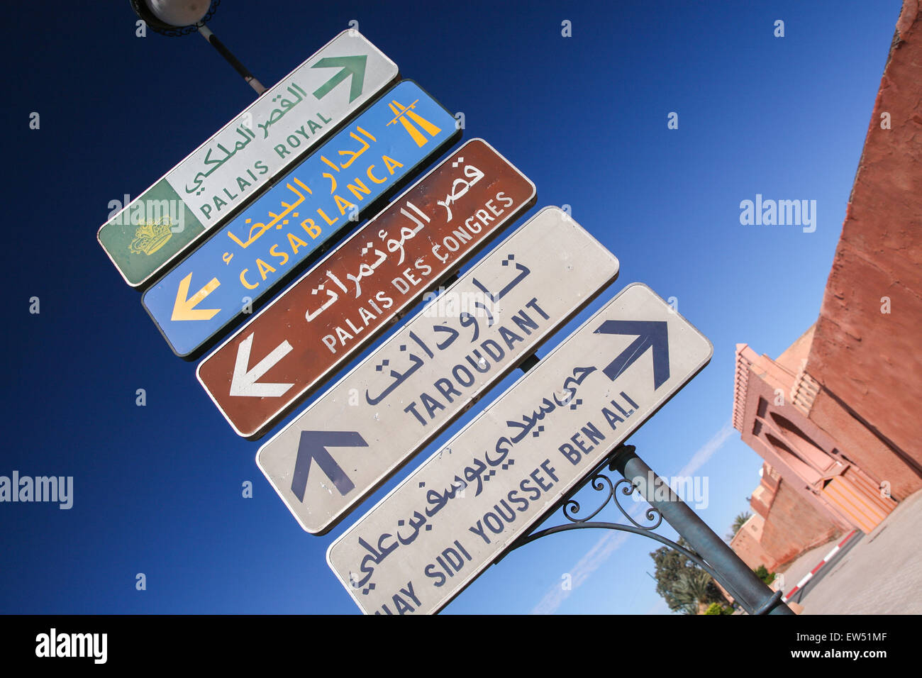 Signpost alongside large wall near the Royal Palace in Marrakesh ...