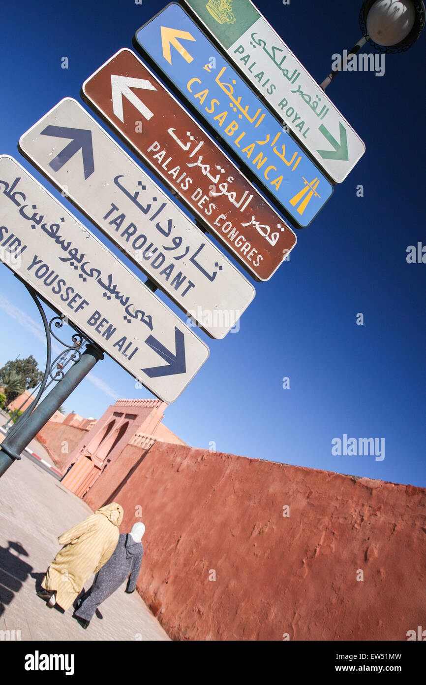 Signpost alongside large wall near the Royal Palace in Marrakesh ...