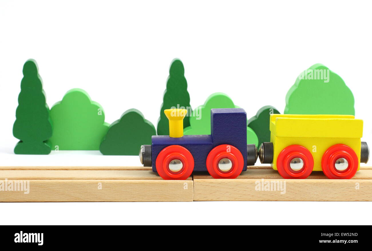Wooden train on the railroad and trees isolated over white Stock Photo ...