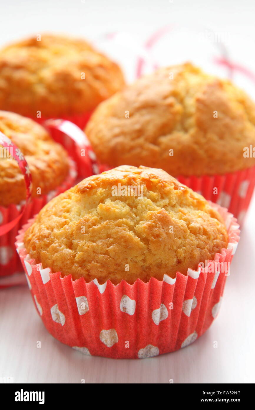 Muffins in red cups on white background Stock Photo - Alamy