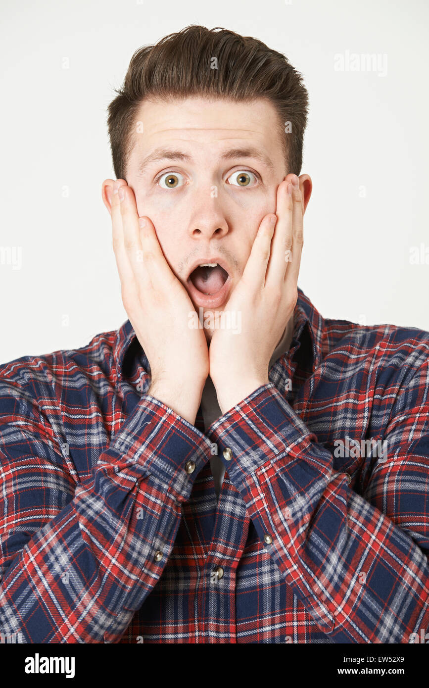 Studio Portrait Of Man With Shocked Expression Stock Photo - Alamy