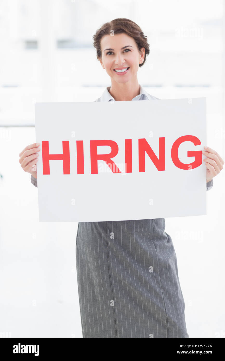 Woman looking hiring sign board hi-res stock photography and images - Alamy