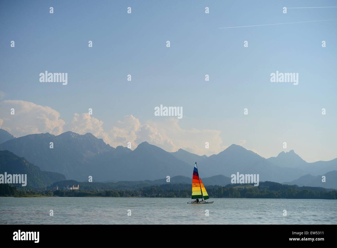 A sailing boat on Lake Forggensee in Bavaria, Germany, near the city of ...