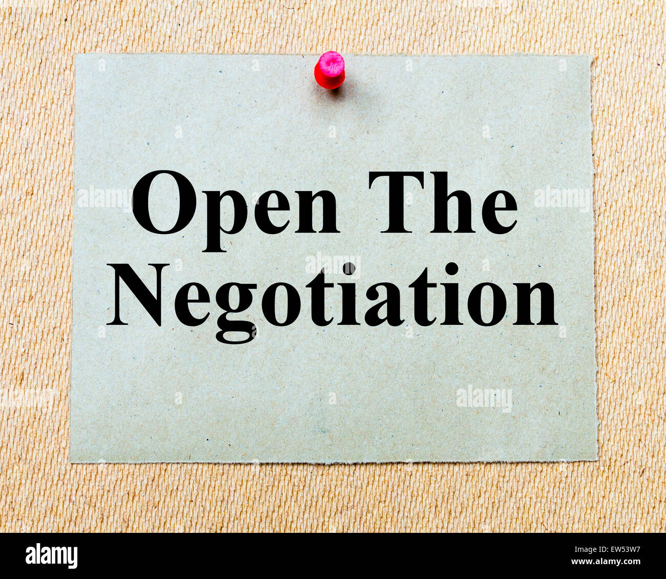 Open The Negotiation written on paper note pinned with red thumbtack on ...