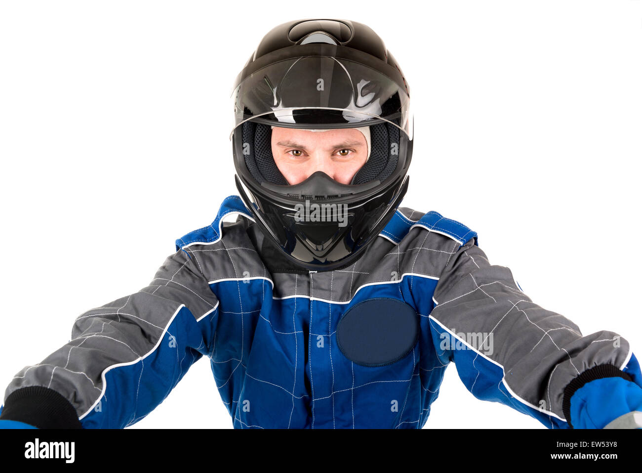 Racing driver posing with helmet isolated in white Stock Photo - Alamy