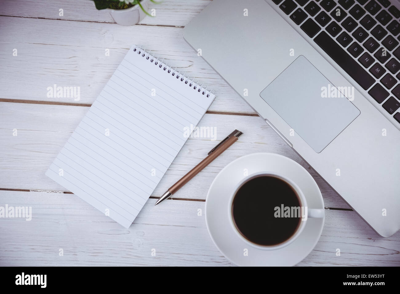 Overhead shot of laptop and notepad Stock Photo - Alamy