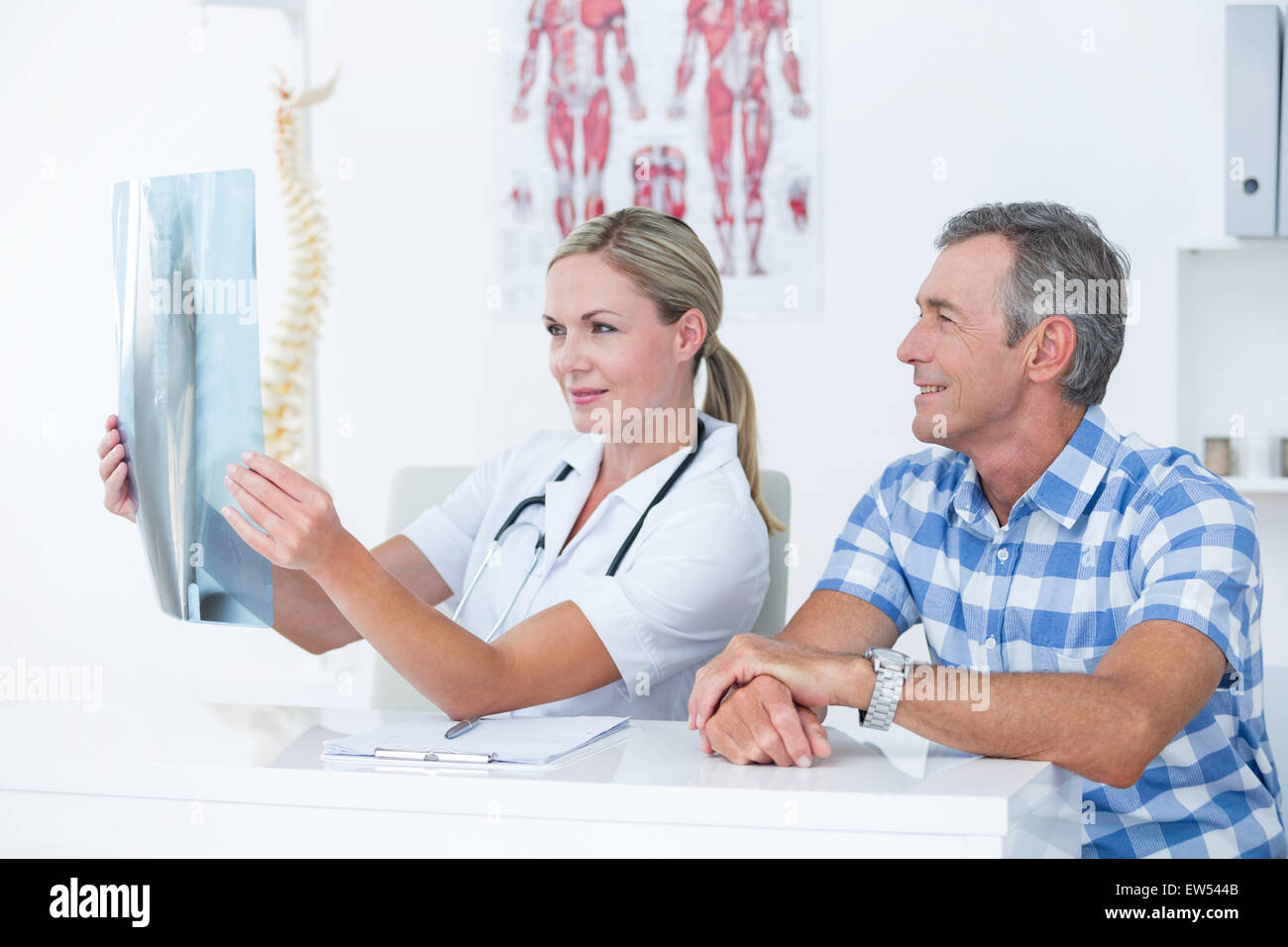 Doctor showing X rays to her patient Stock Photo - Alamy