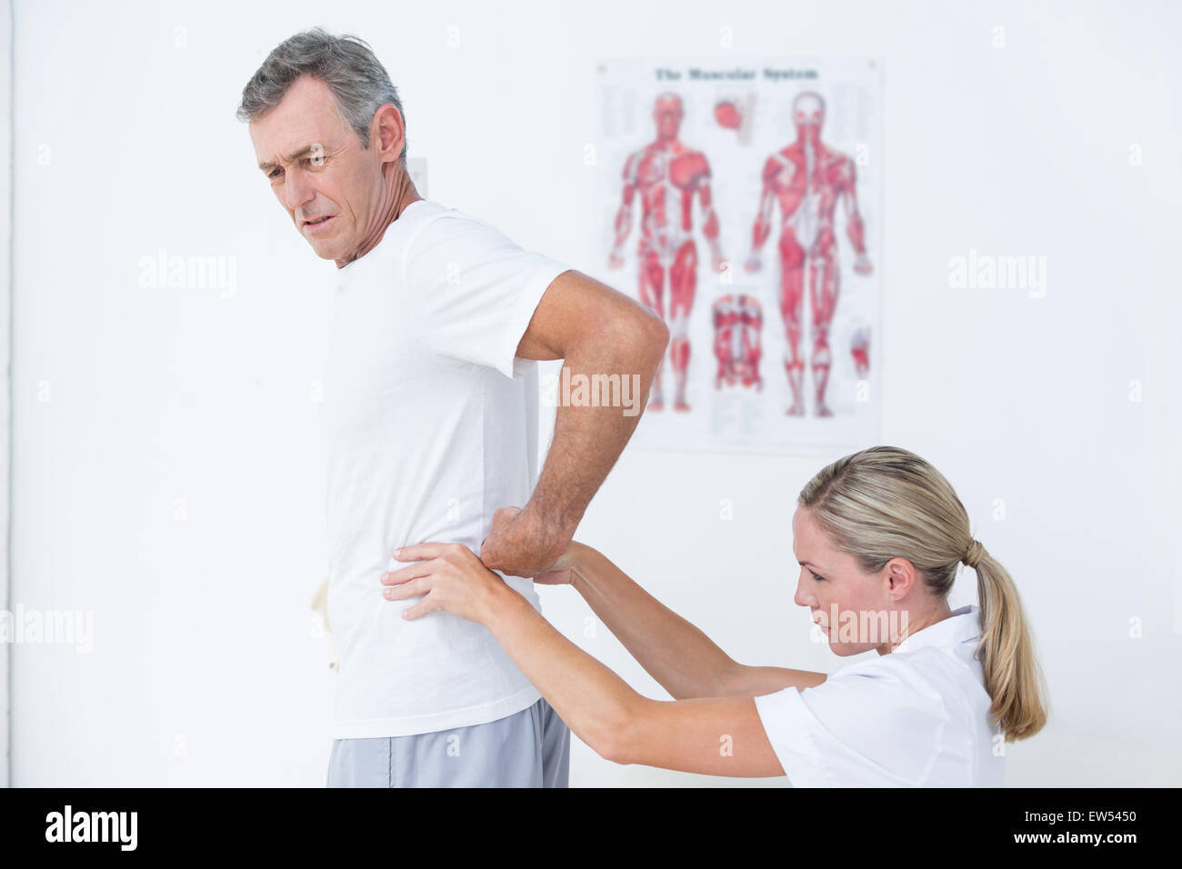 Doctor examining her patient back Stock Photo - Alamy