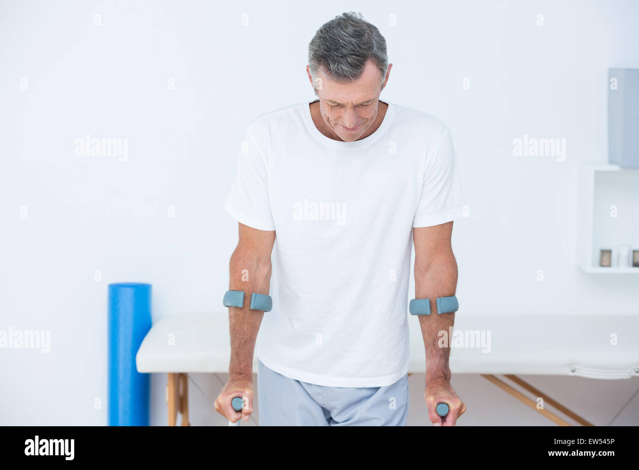 Patient standing with crutch Stock Photo - Alamy