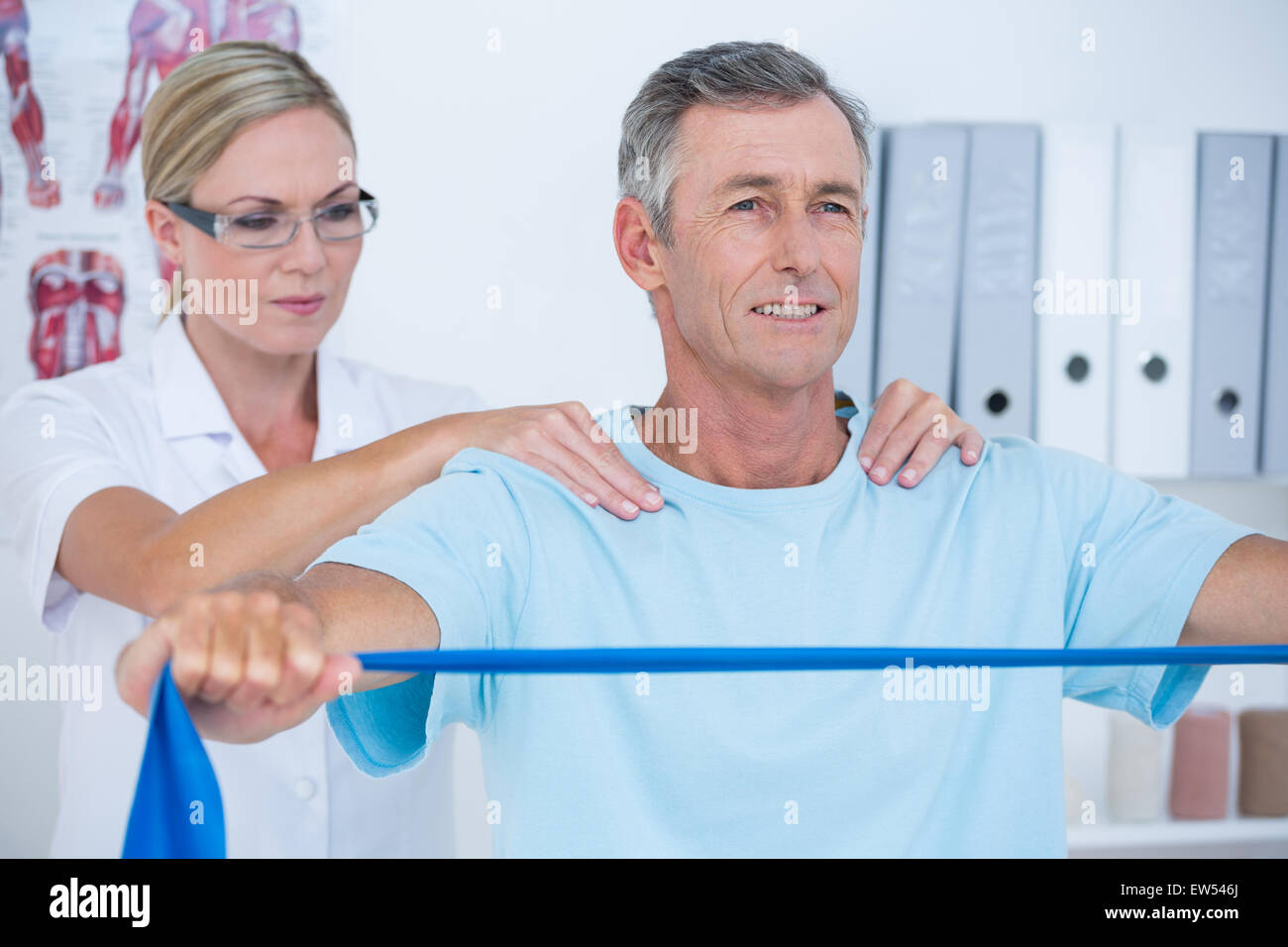 Doctor examining her patient back Stock Photo - Alamy