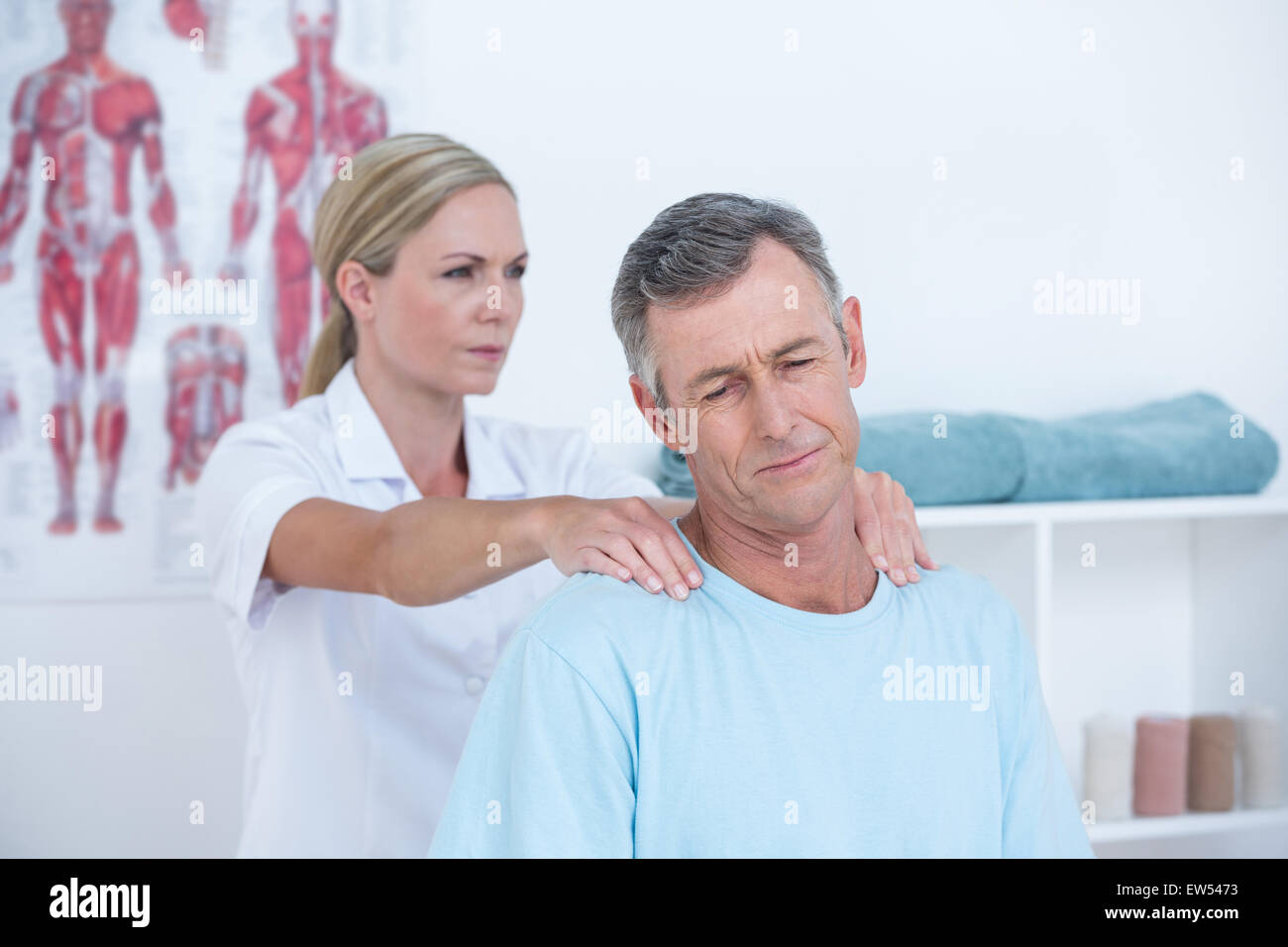 Doctor stretching her patient neck Stock Photo - Alamy