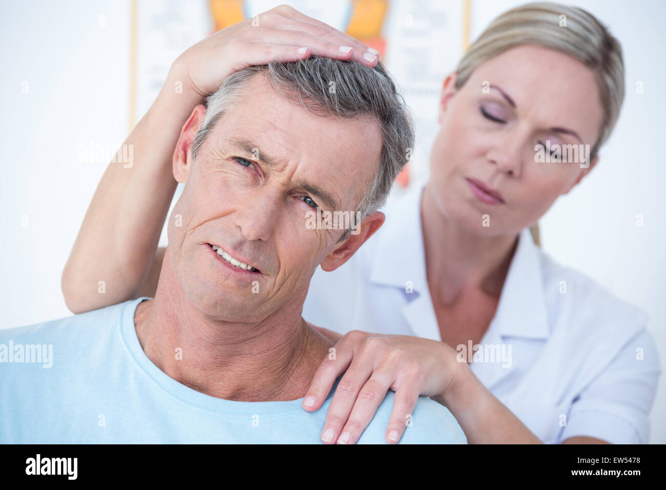 Doctor stretching her patient neck Stock Photo - Alamy