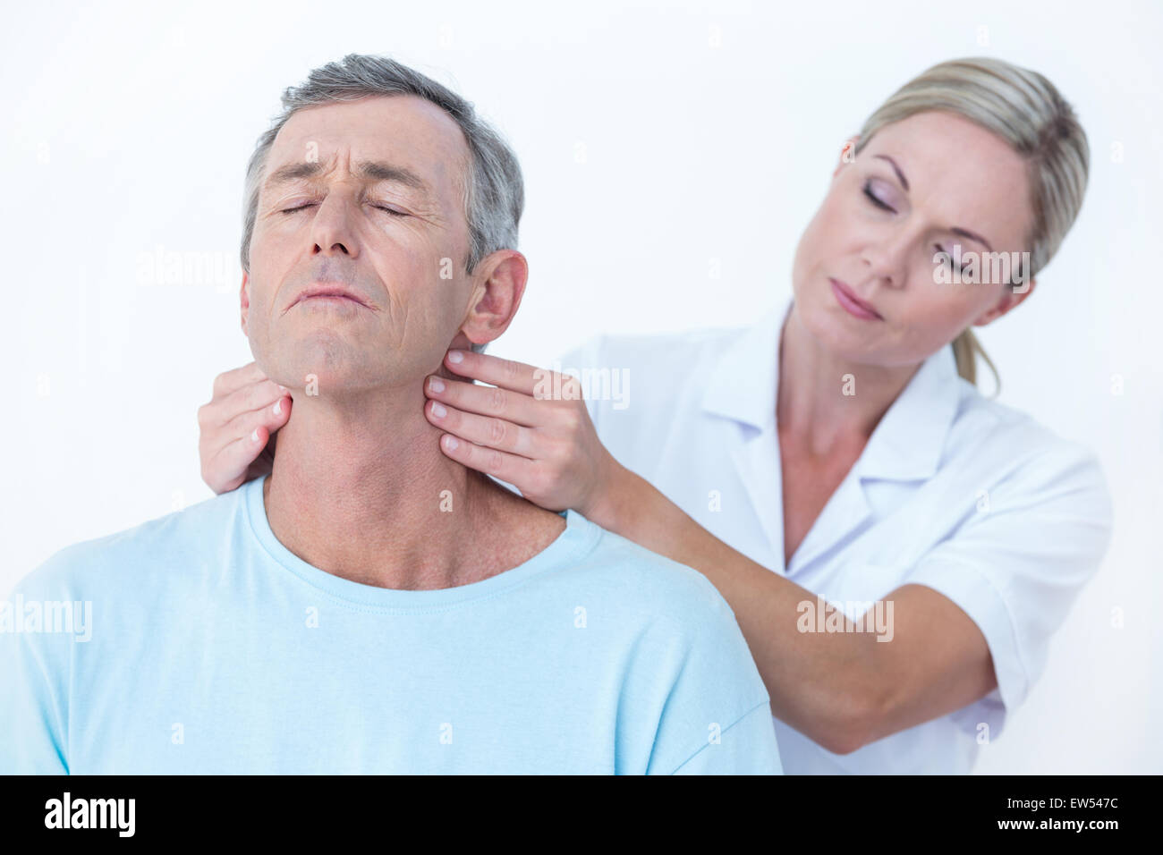 Doctor stretching her patient neck Stock Photo - Alamy