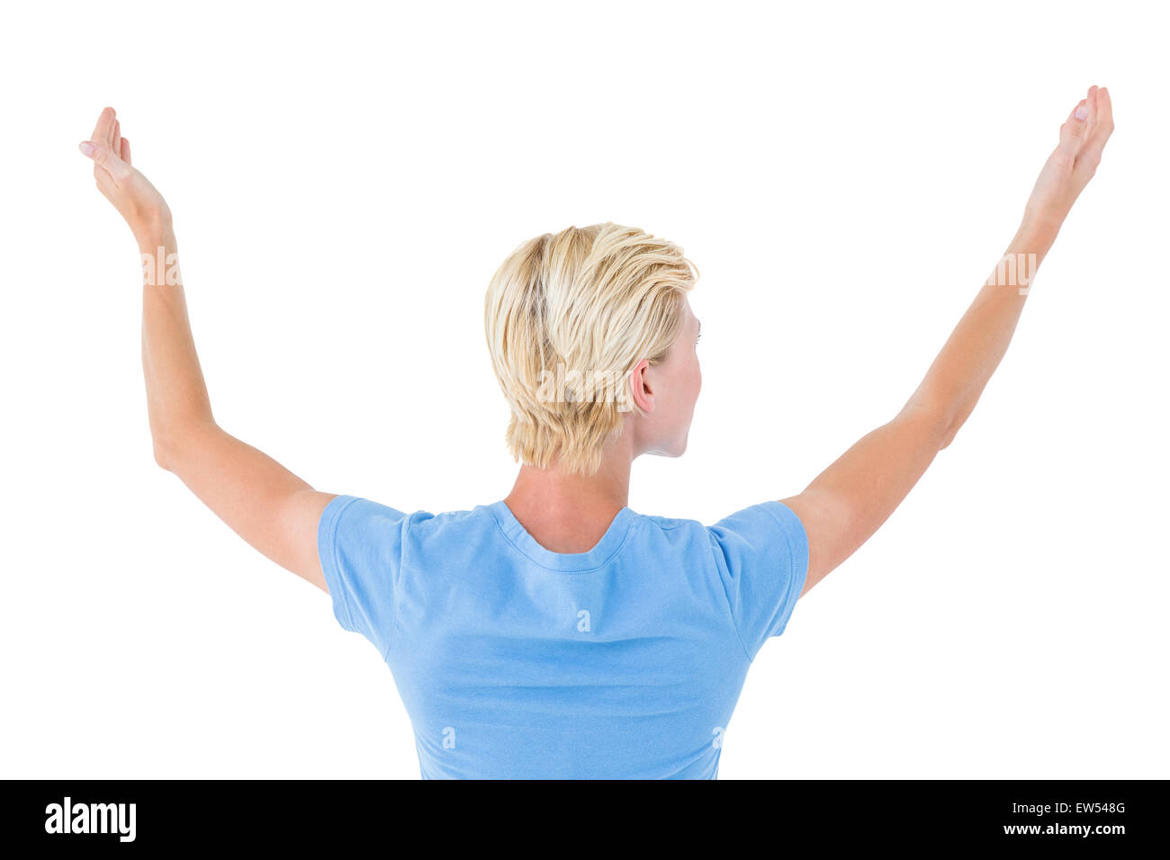 Blonde woman gesturing back to camera Stock Photo - Alamy