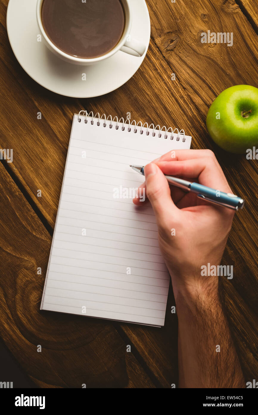 Hand writing on the notepad Stock Photo - Alamy