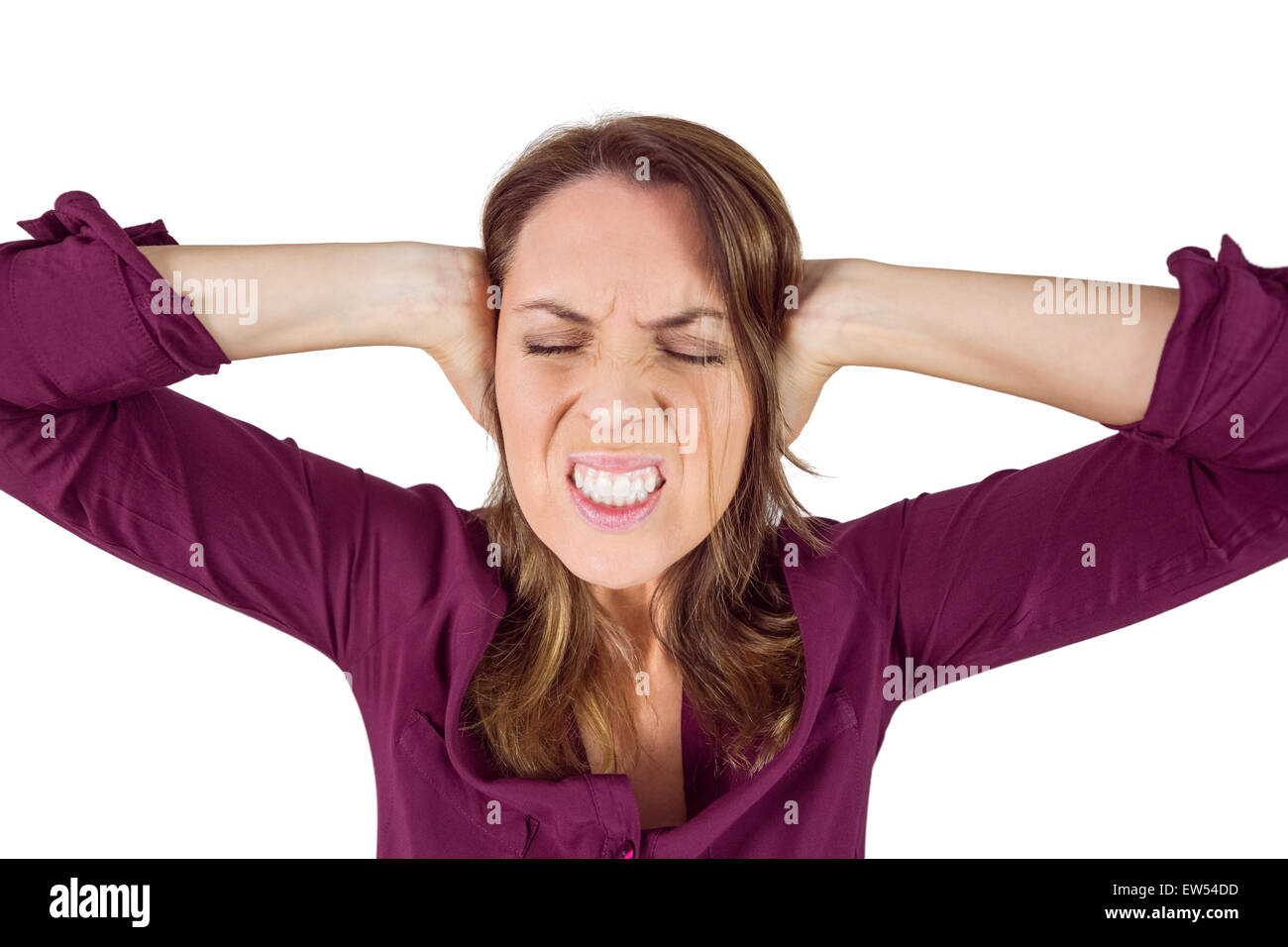 Pretty brunette shouting with hands on head Stock Photo - Alamy