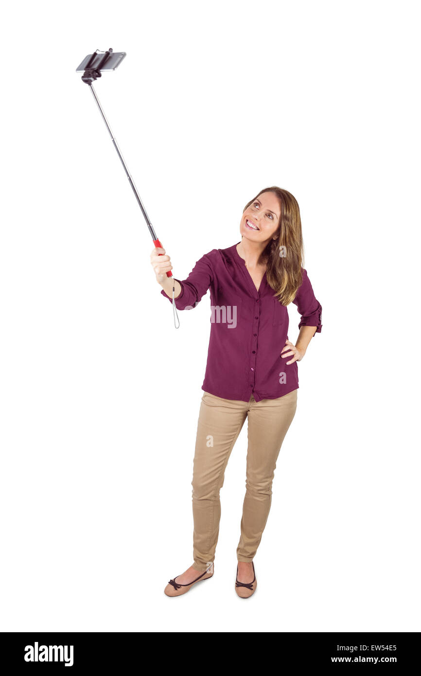 Woman and selfie stick hi-res stock photography and images - Alamy