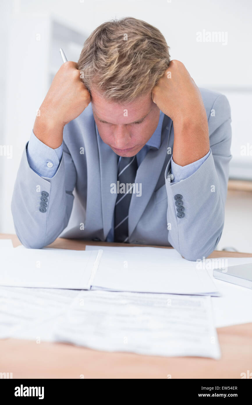 Businessman being depressed by working Stock Photo - Alamy