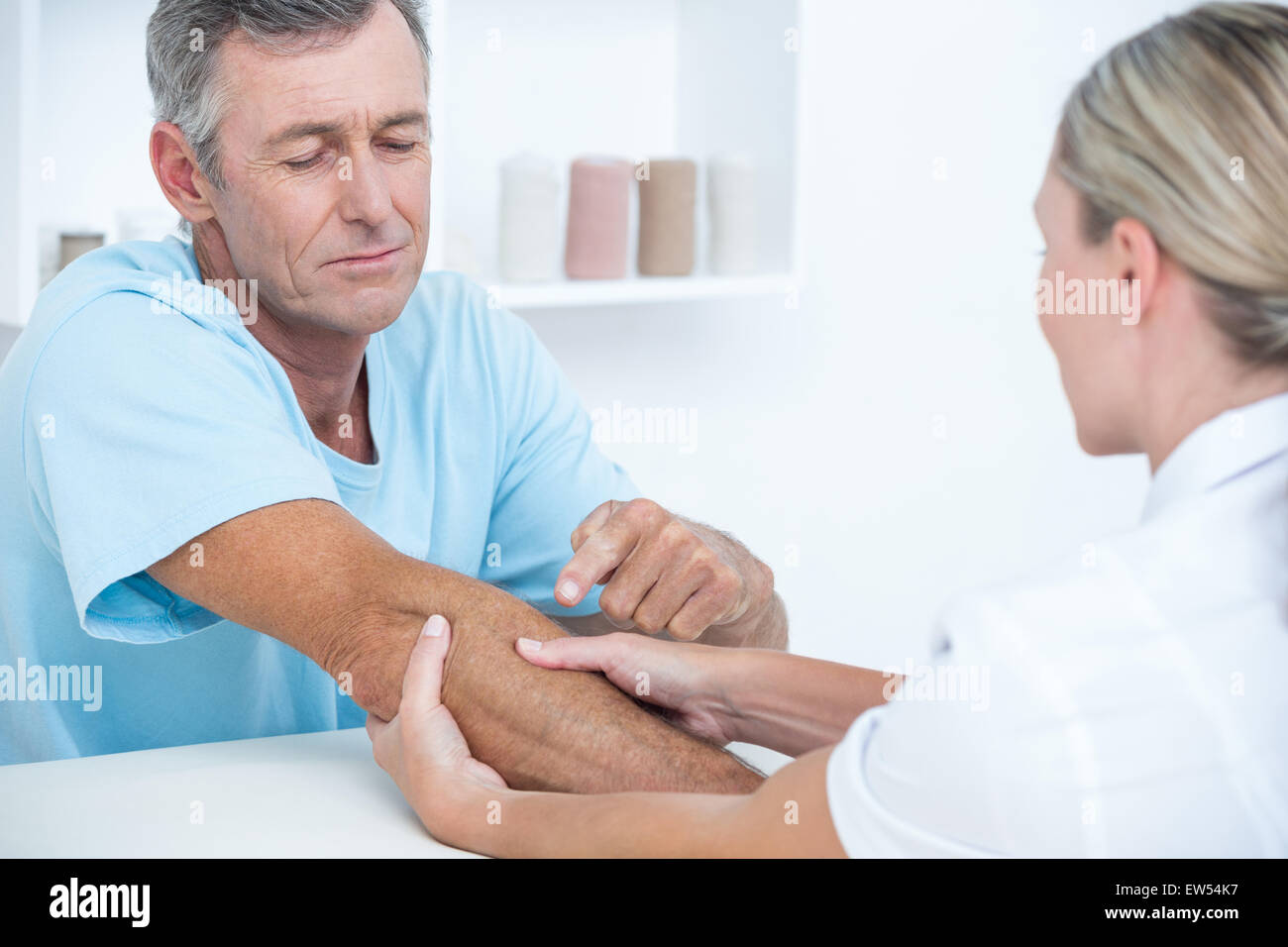 Doctor doing arm massage Stock Photo - Alamy