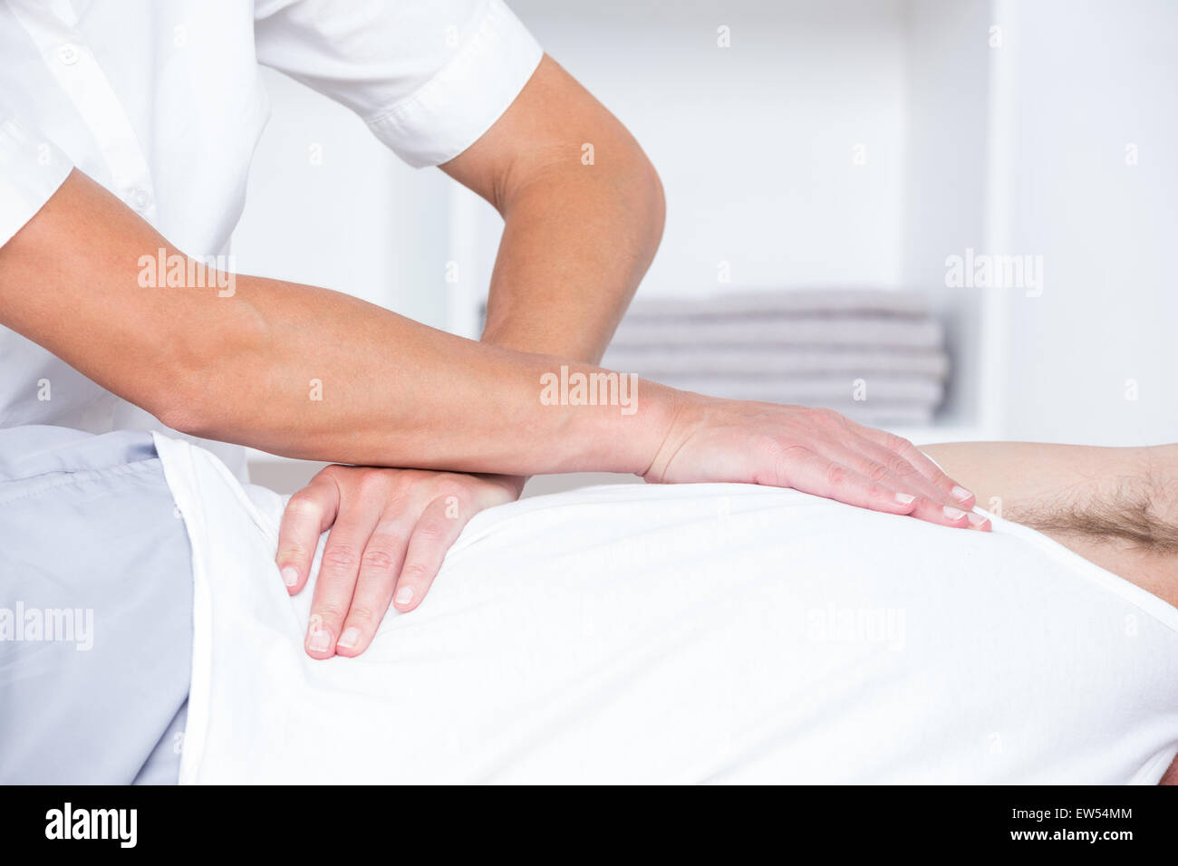 Doctor examining her patient back Stock Photo - Alamy