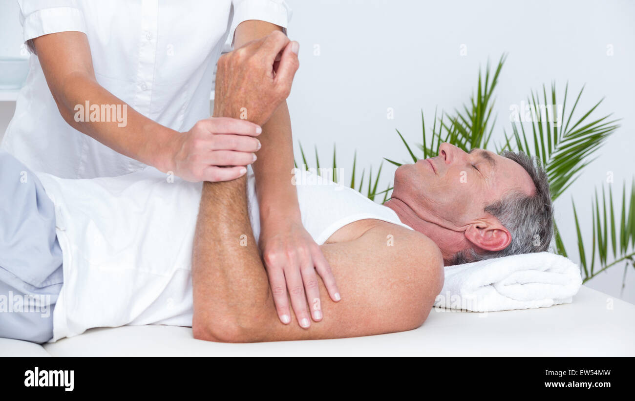 Doctor examining her patient arm Stock Photo - Alamy