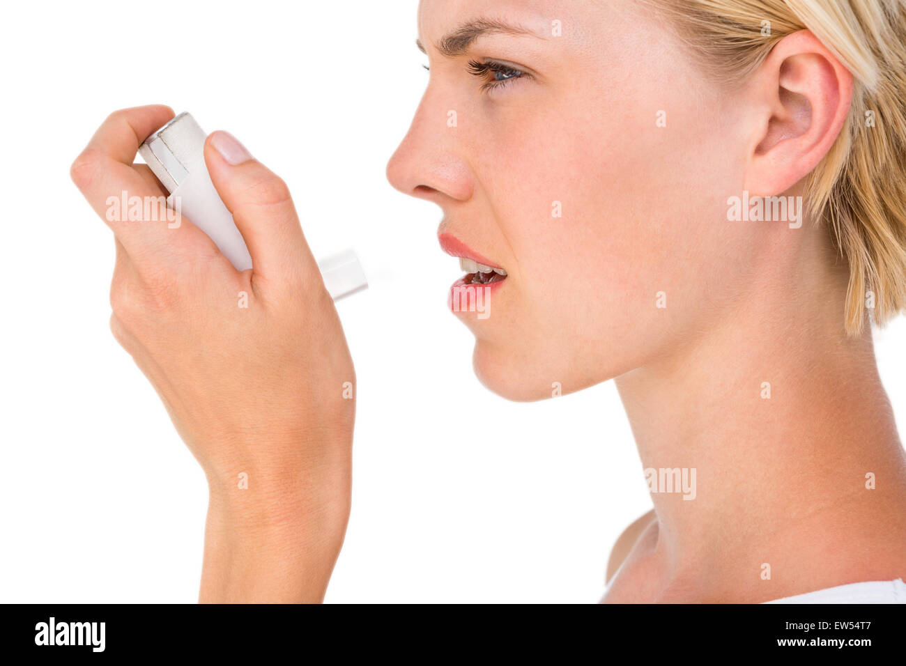 Asthmatic pretty blonde woman using inhaler Stock Photo - Alamy