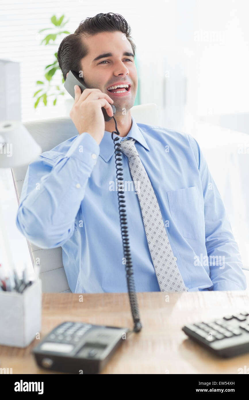 Cheerful young businessman laughing hi-res stock photography and images ...