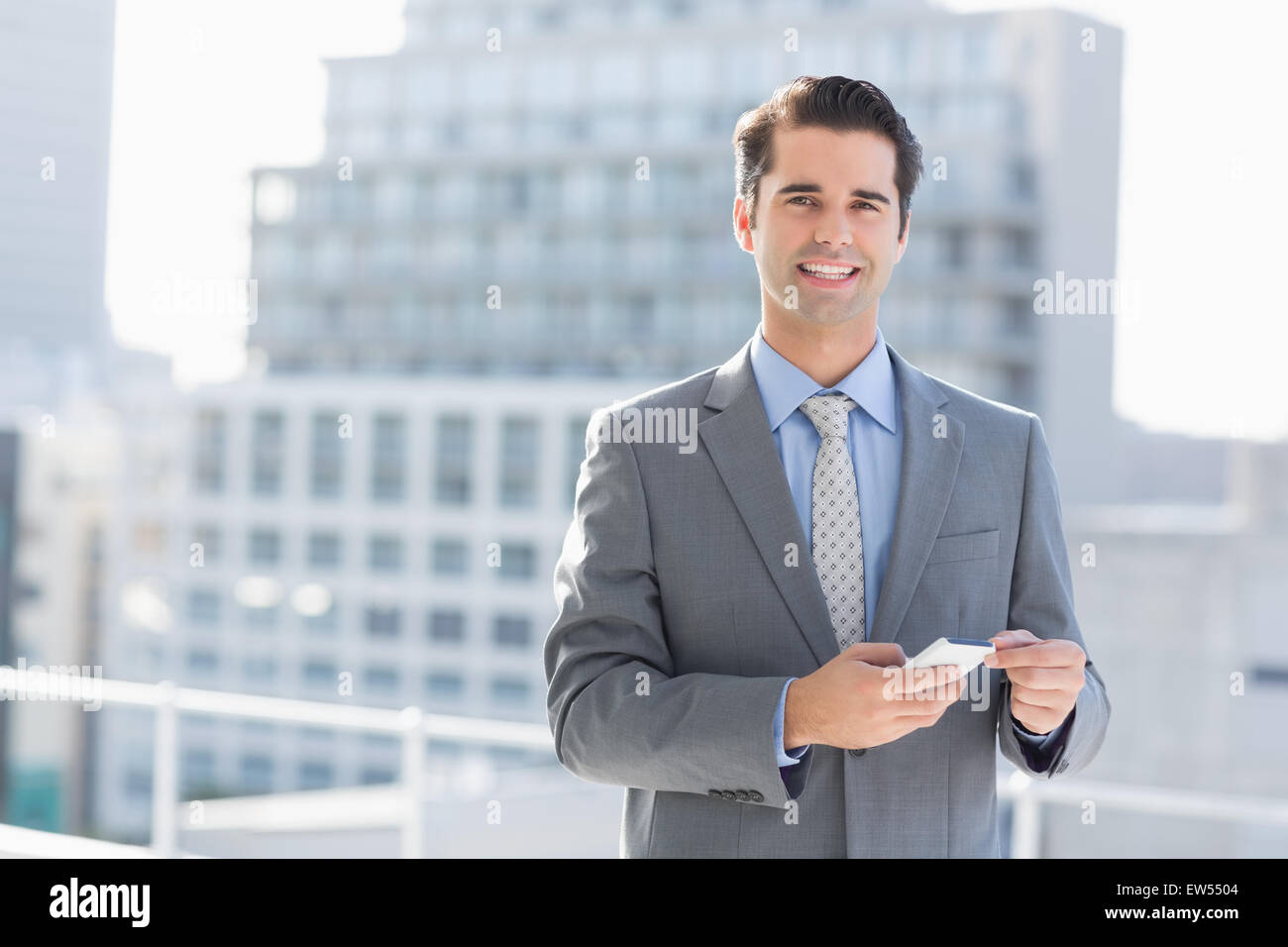 Smiling while texting hi-res stock photography and images - Alamy