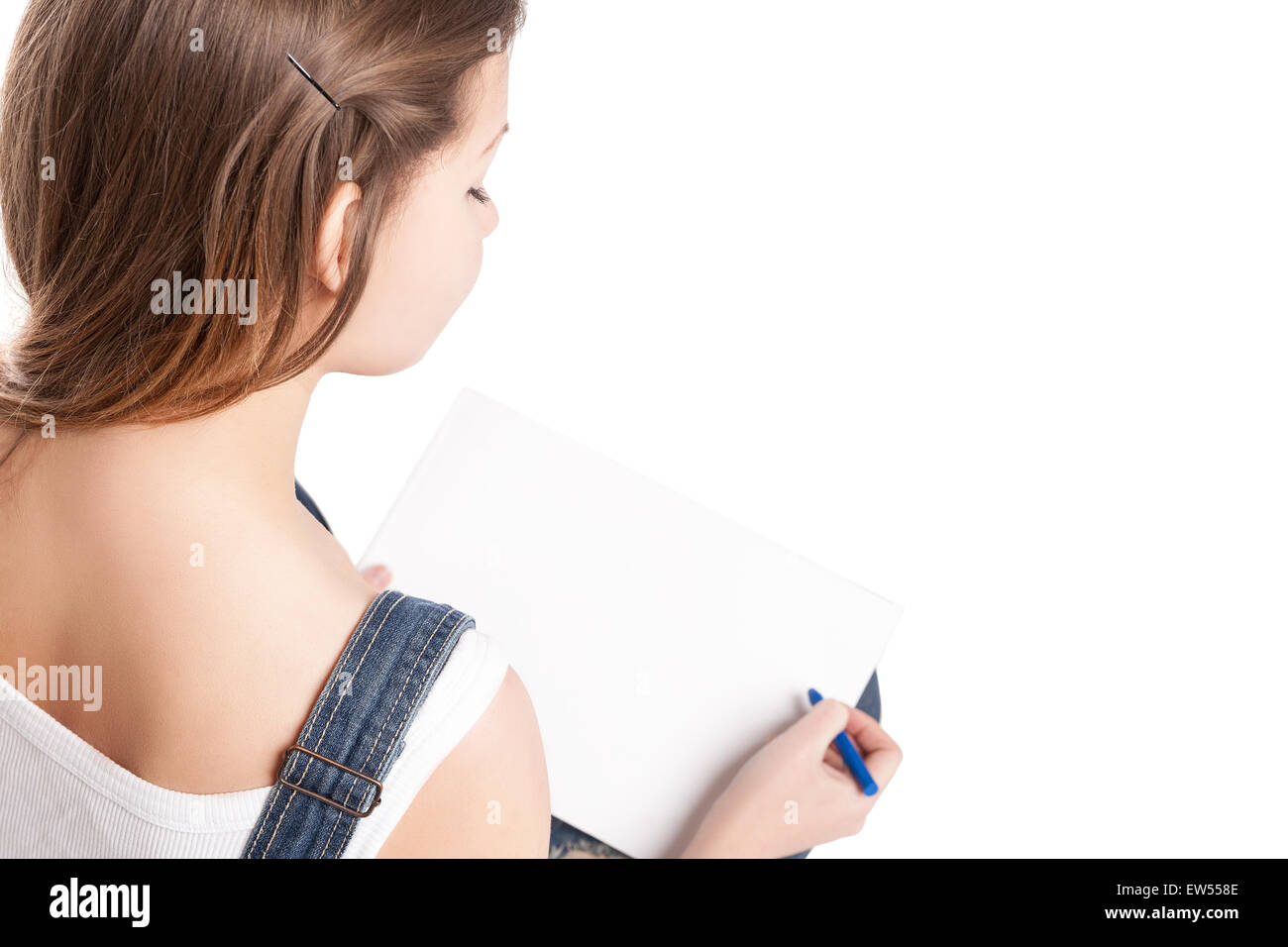 Young woman drawing in her note pad. Back view Stock Photo - Alamy
