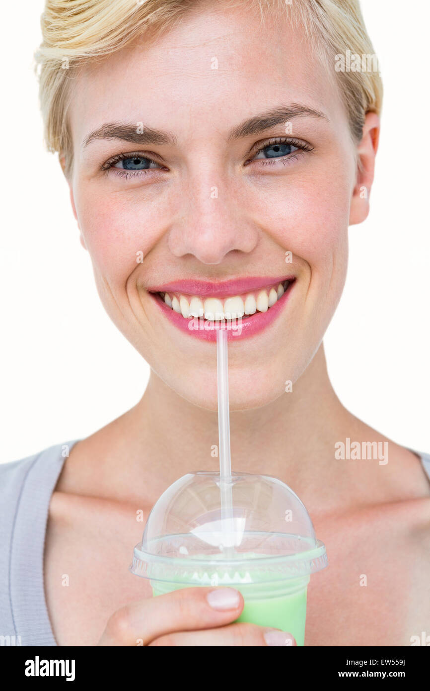 Attractive blonde woman holding healthy juice Stock Photo - Alamy