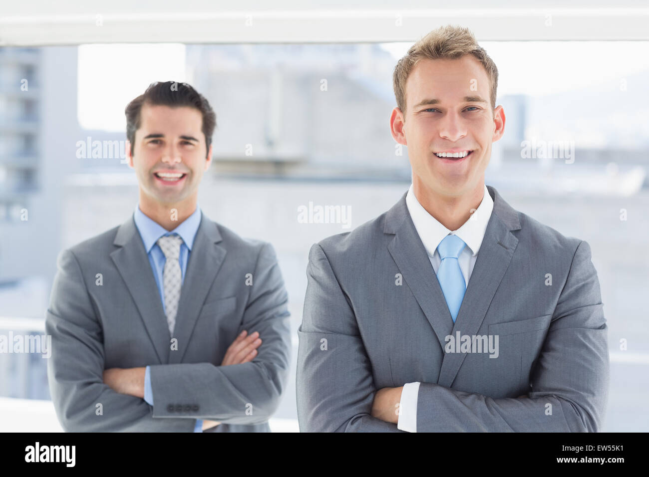 Two happy young businessmen hi-res stock photography and images - Alamy