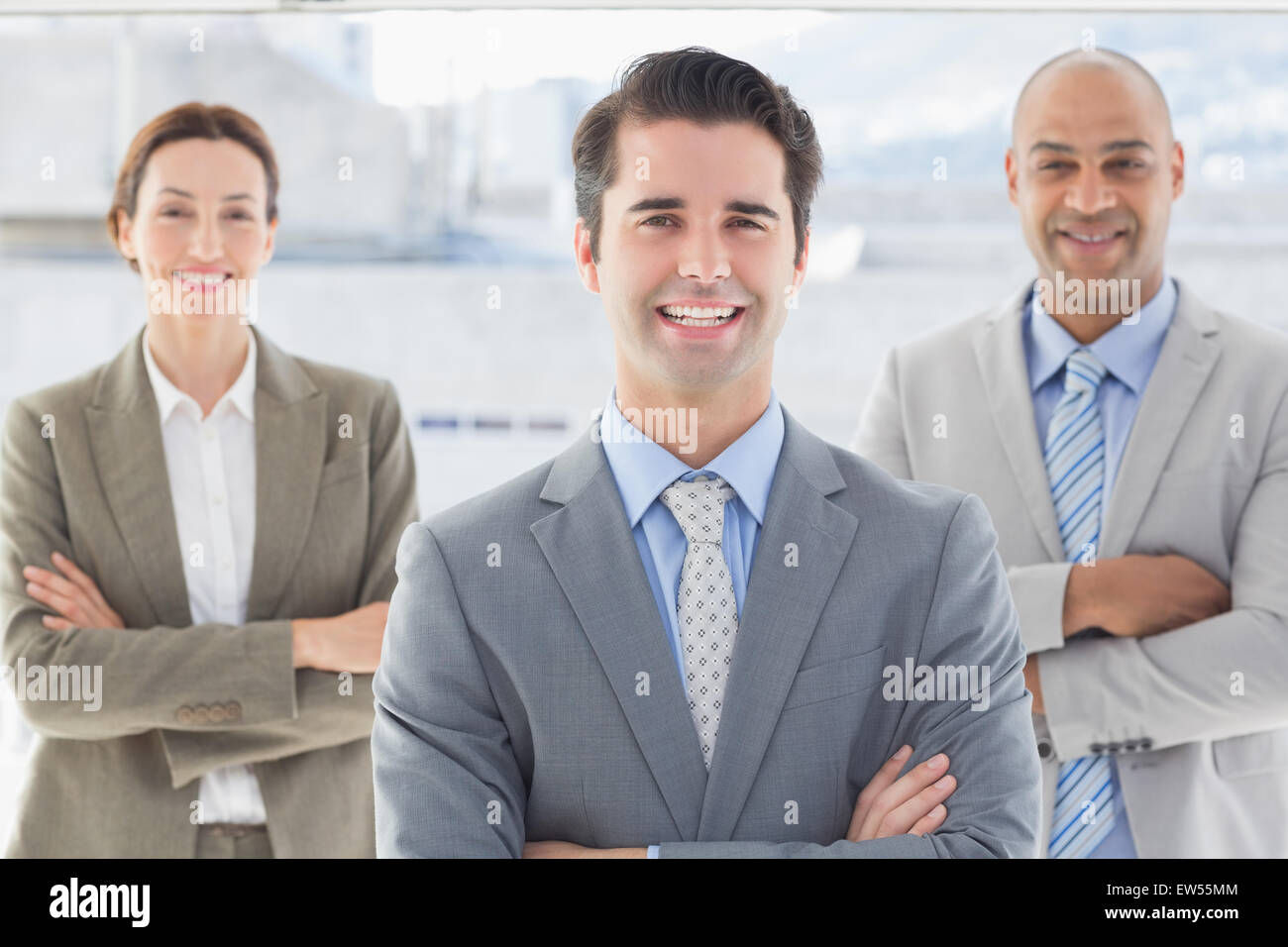 Smiling business colleagues arms hi-res stock photography and images ...